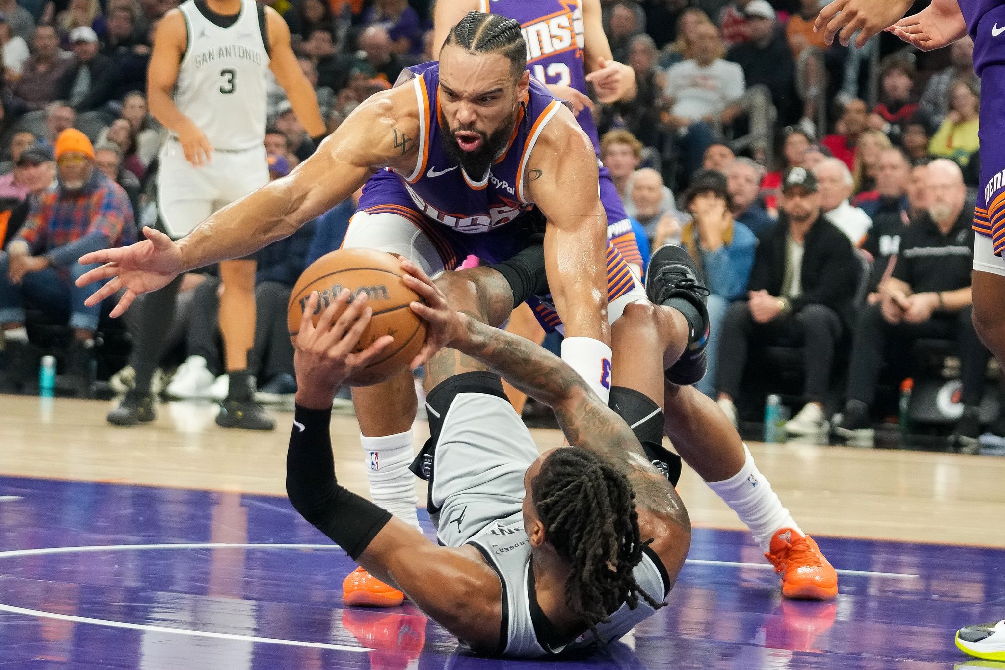 Suns win 3rd straight and end Spurs' 3-game run with 111-102 victory