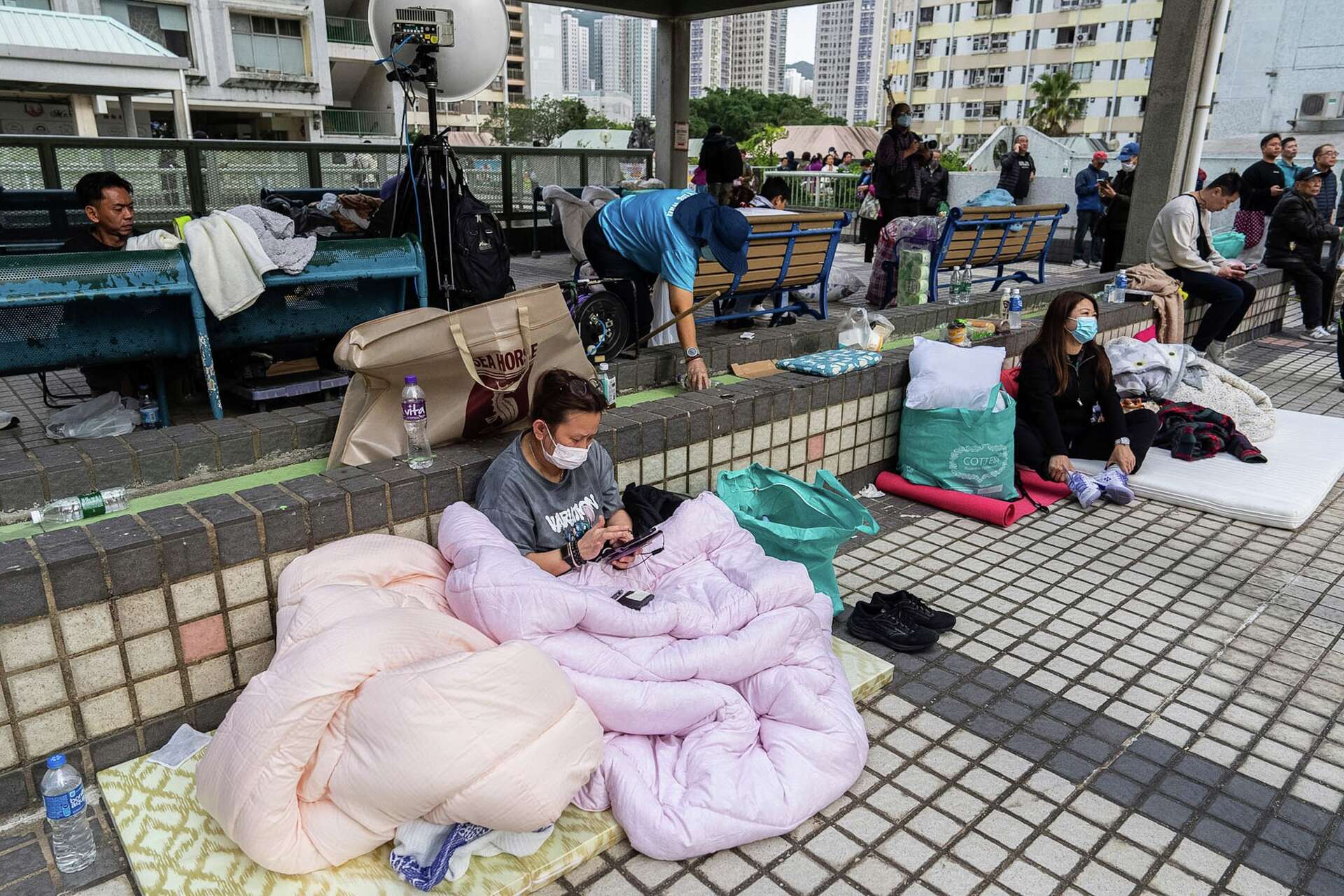 At least 94 dead as Hong Kong firefighters battle burning towers for a ...