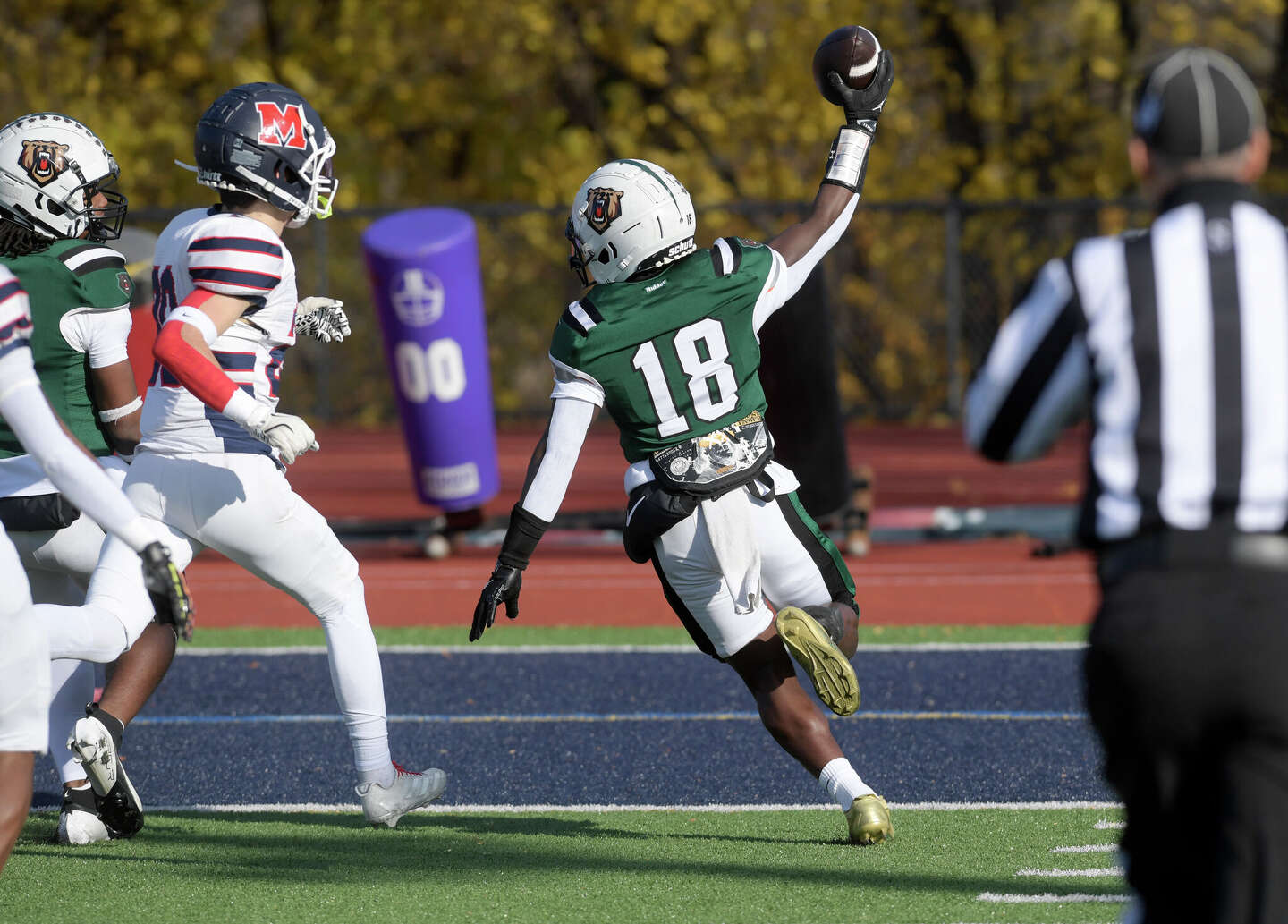 Norwalk football defeated Brien McMahon to keep tjhe Sam Testa Trophy