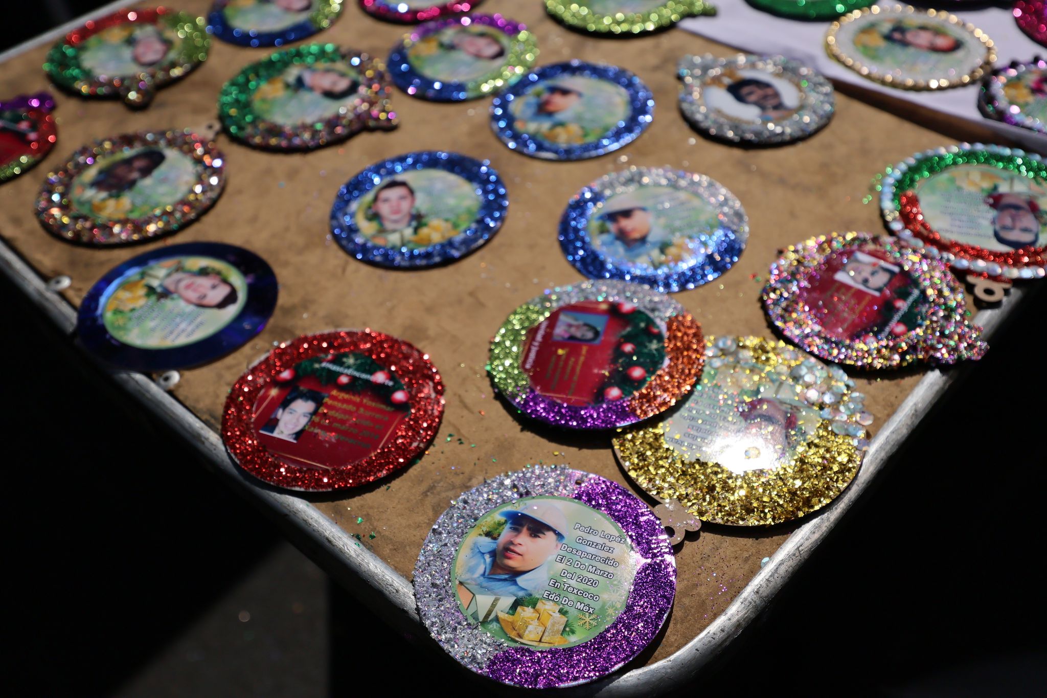 A Christmas tree in Mexico carries the faces of loved ones who never ...