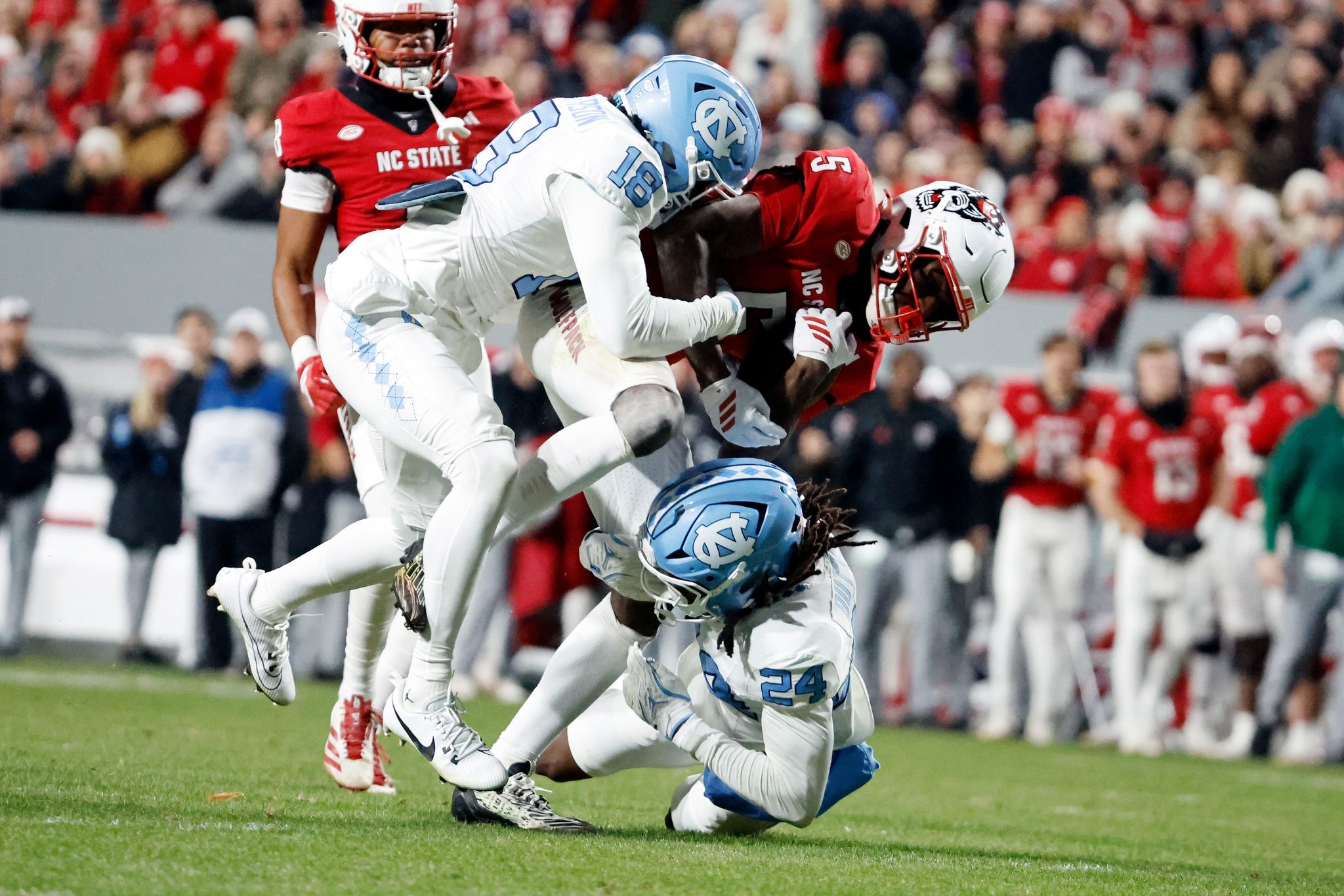 Wilson runs for 4 TDs as NC State beats UNC 42-19, winning rivalry game ...
