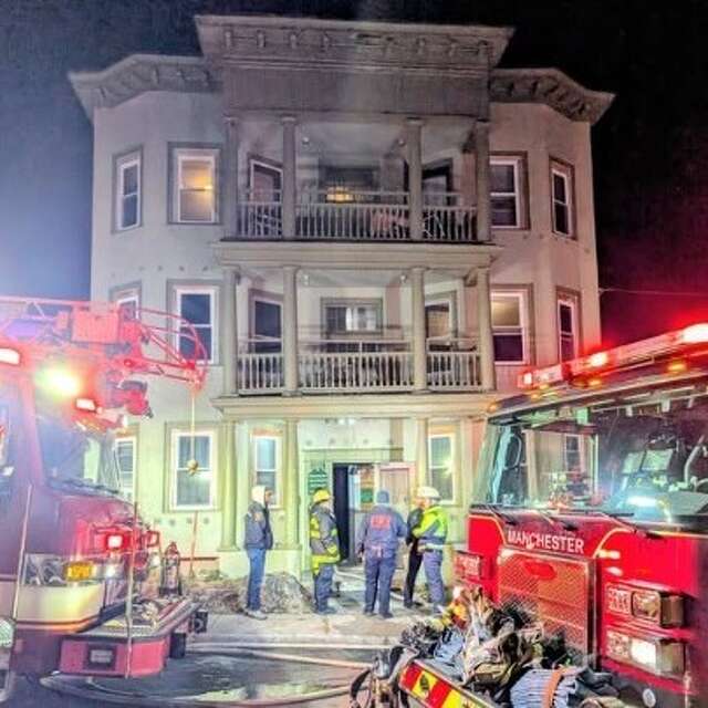One dead, three rescued, one in custody in Manchester blaze