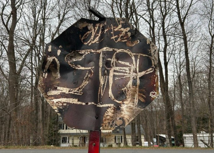 New Fairfield stop sign set on fire at Sugar Maple Lane, police say