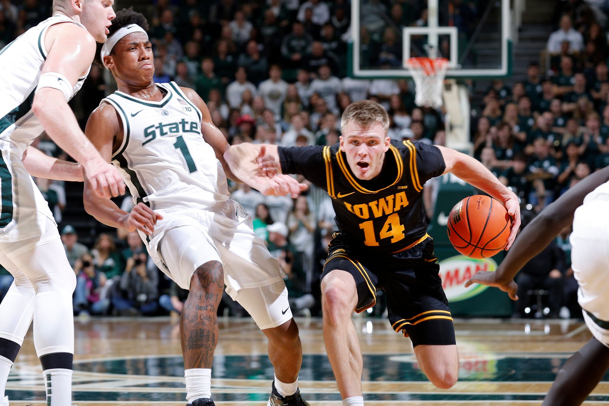 No. 7 Michigan St beats Iowa 71-52 to open defense of Big Ten title