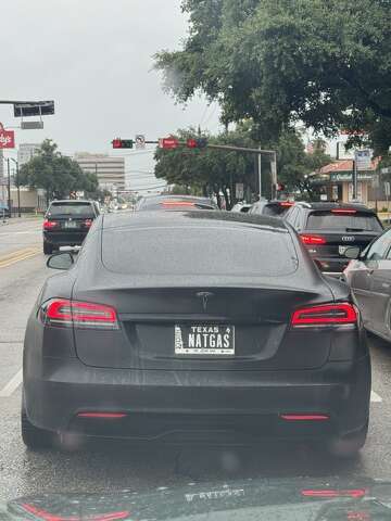 Houston’s Tesla drivers put oil, gas and coal on their license plates