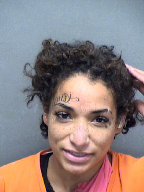 Woman accused of putting razor blades in bread has record here
