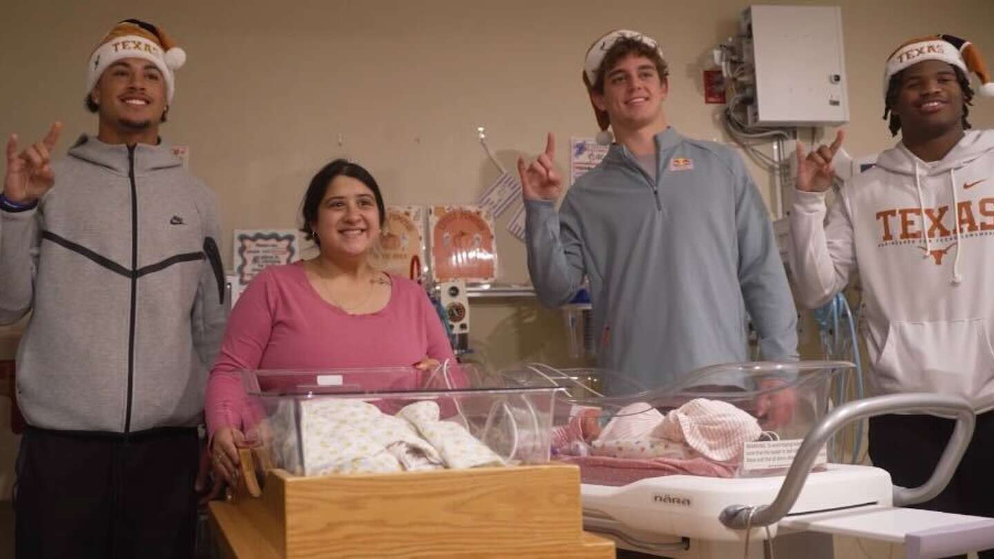 Watch: Texas football players make a surprise Austin hospital visit