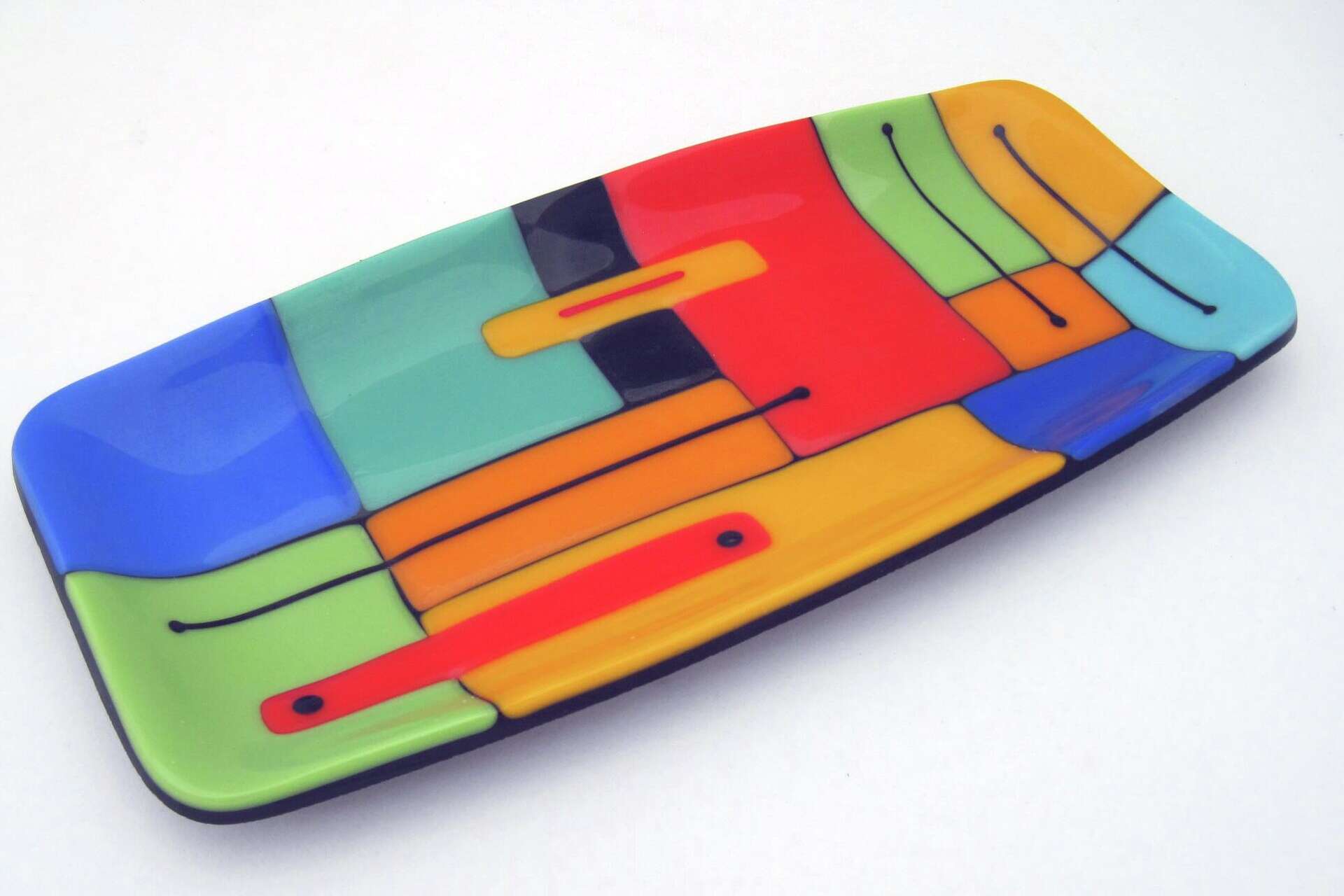 Wendy Bedolla crafts fused glass art in Manistee, Michigan