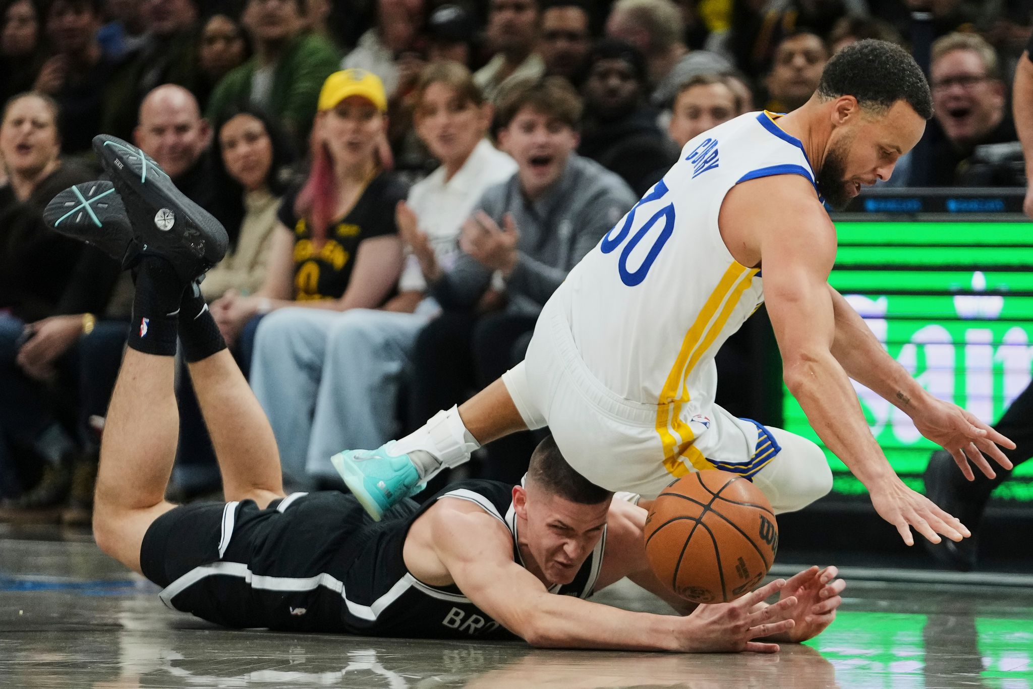 Curry, Butler lead the Warriors to a 120-107 victory over the Nets