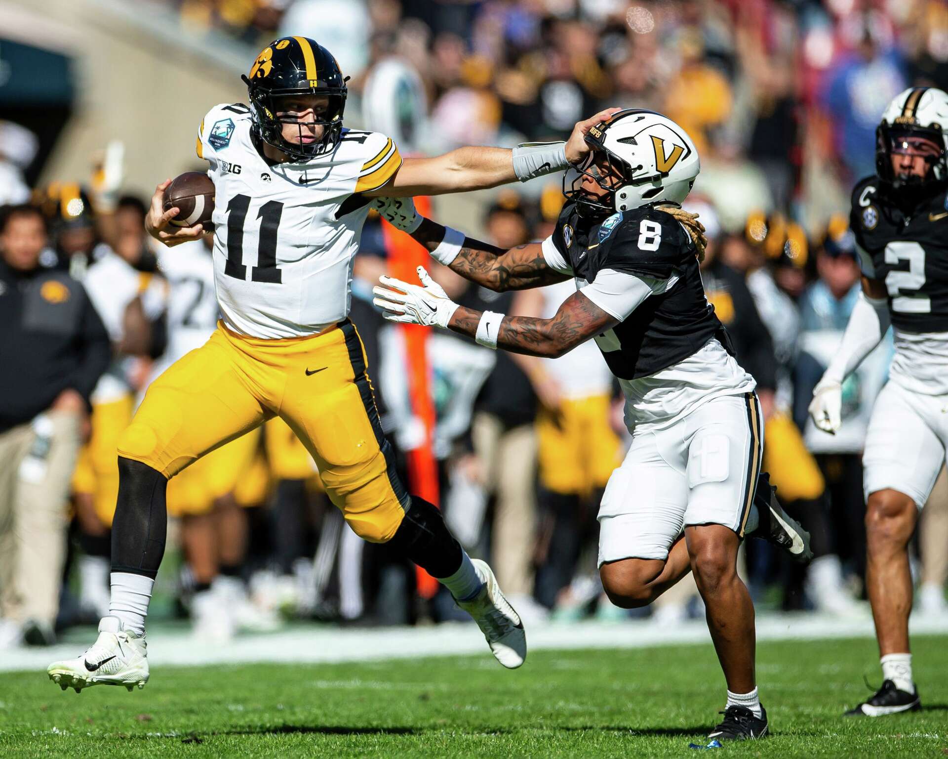 Iowa holds off Vanderbilt's comeback bid for 34-27 victory in the ...
