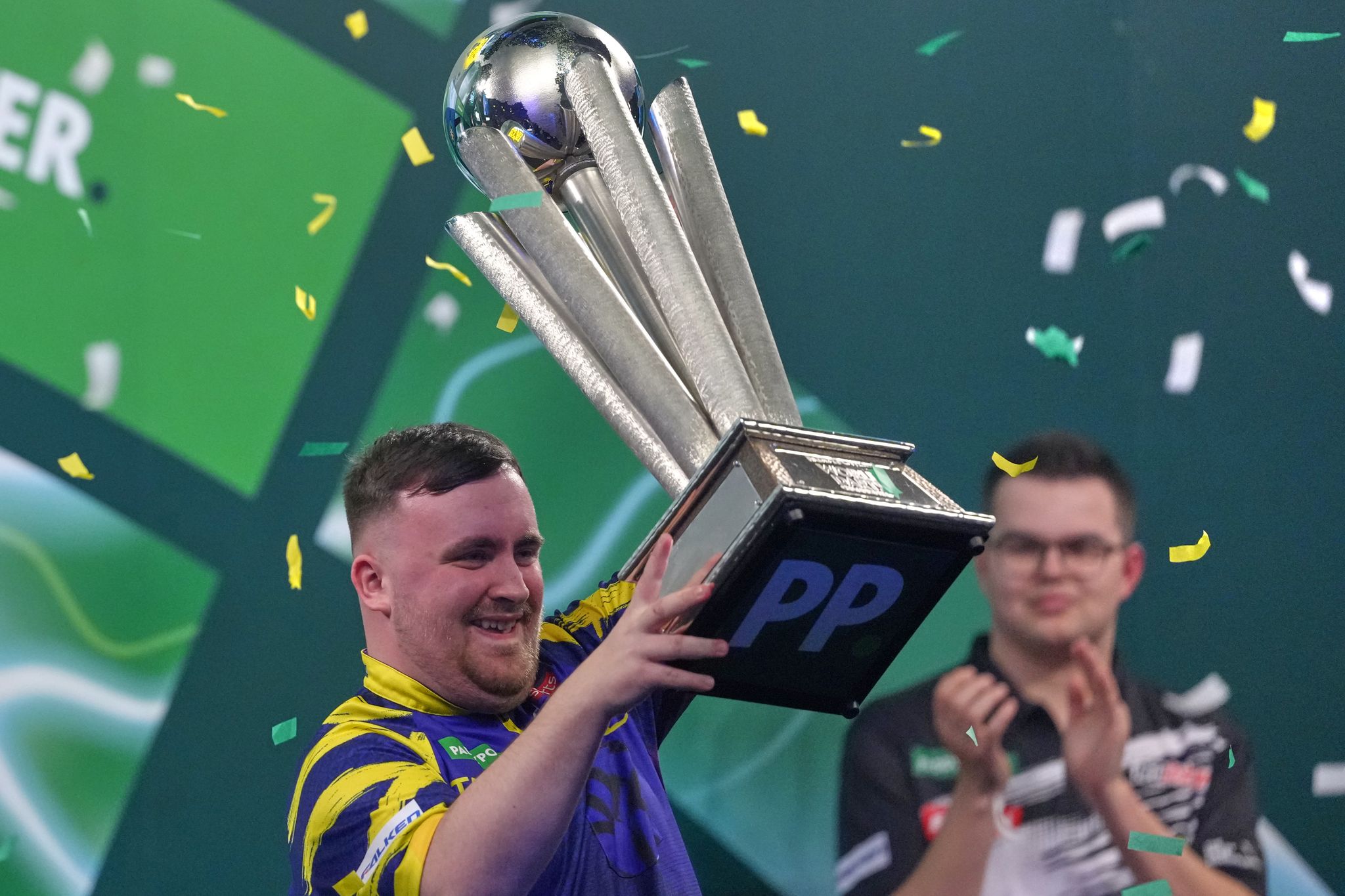 Littler wins back-to-back world darts titles at 18