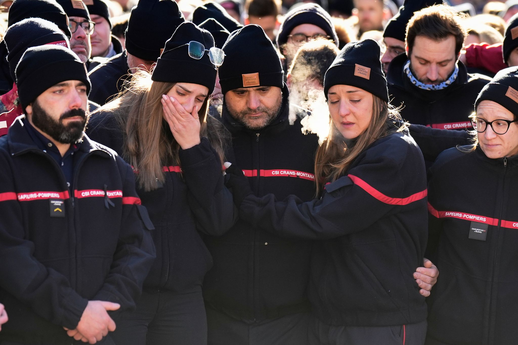 Hundreds march in silence to honor victims of Swiss bar fire that left ...