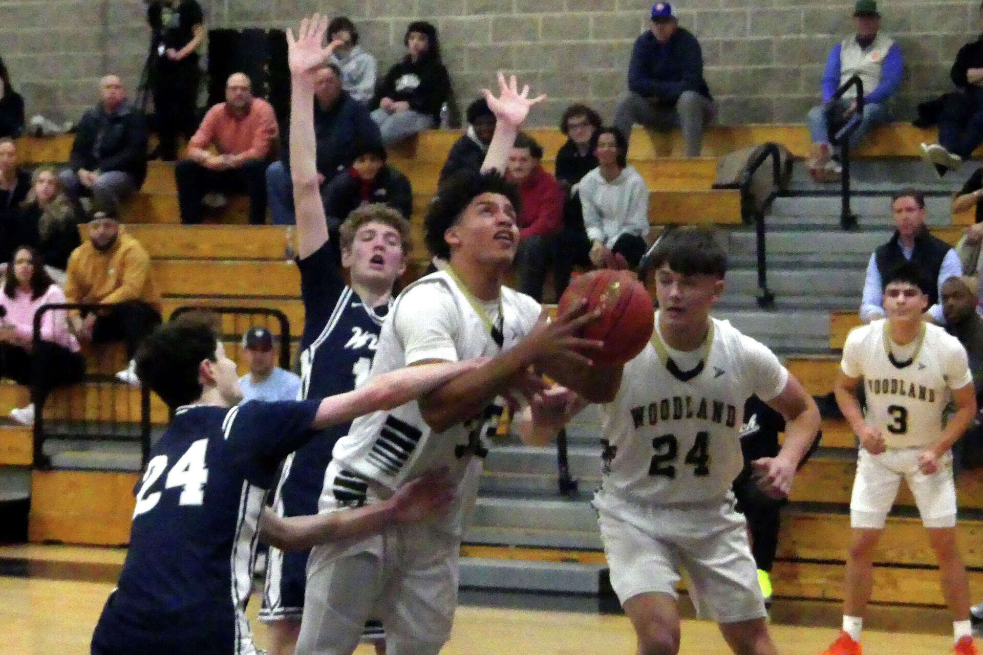 Woodland pulls away from Wilton in battle of boys hoop unbeatens