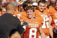 Texas star throws up 'Hook 'Em Horns' sign despite severe burns