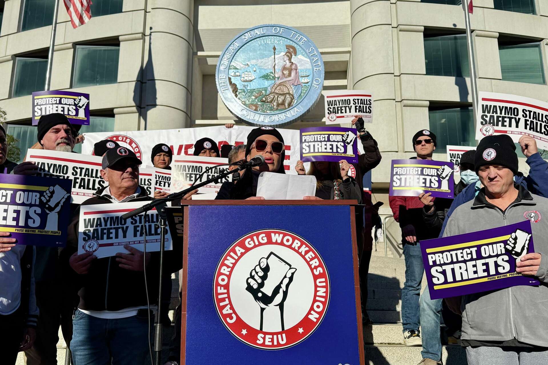 Lyft and Uber drivers protest Waymo robotaxis as California considers ...