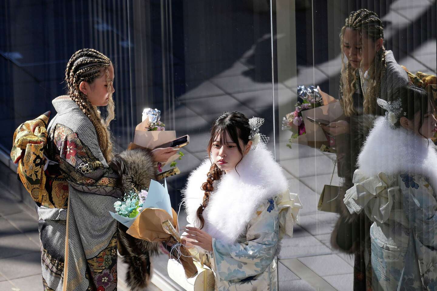 Photos of 20-year-olds at a Coming of Age Day ceremony in Japan