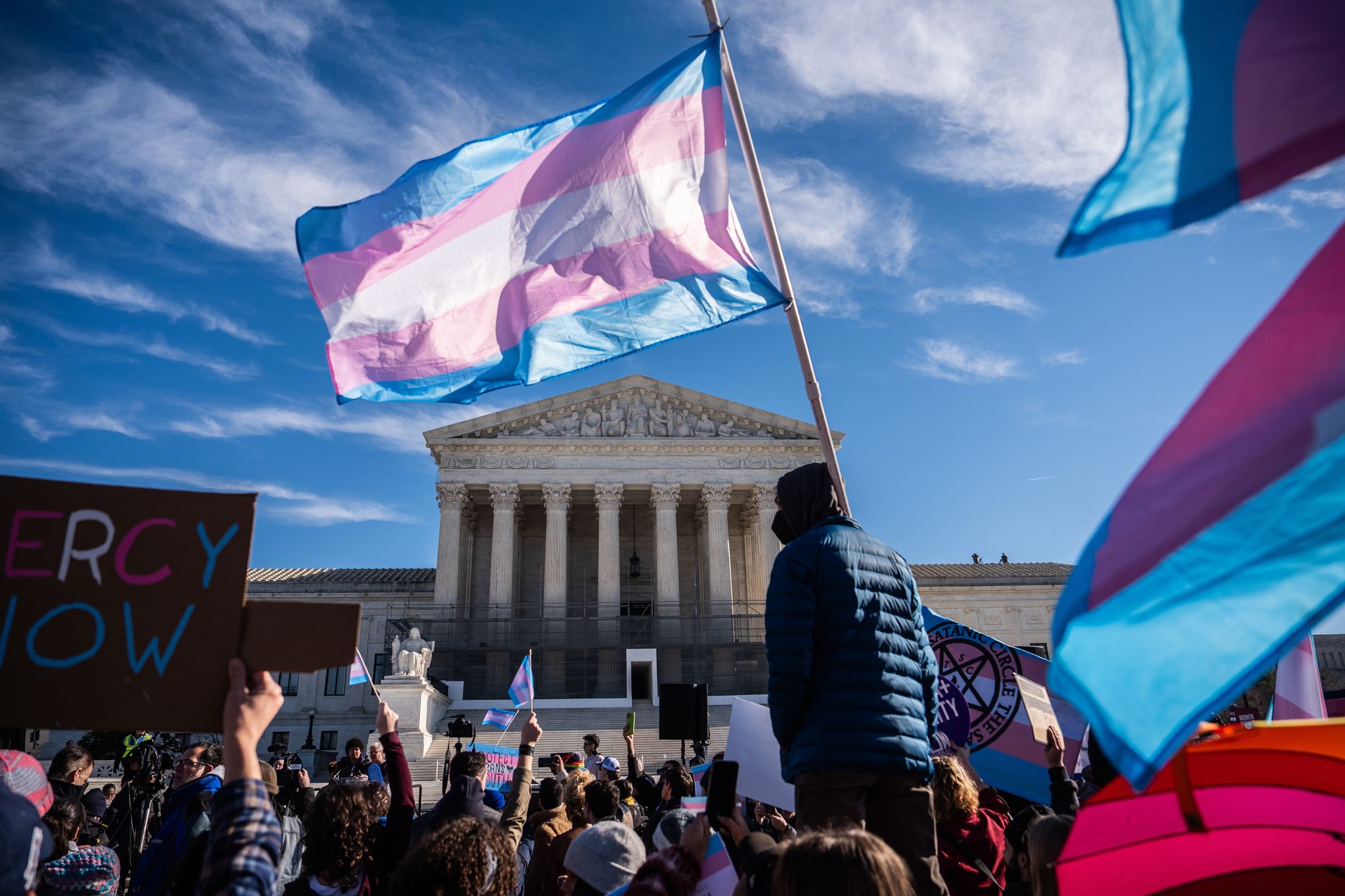 Photos of demonstrators outside the Supreme Court as it considers ...