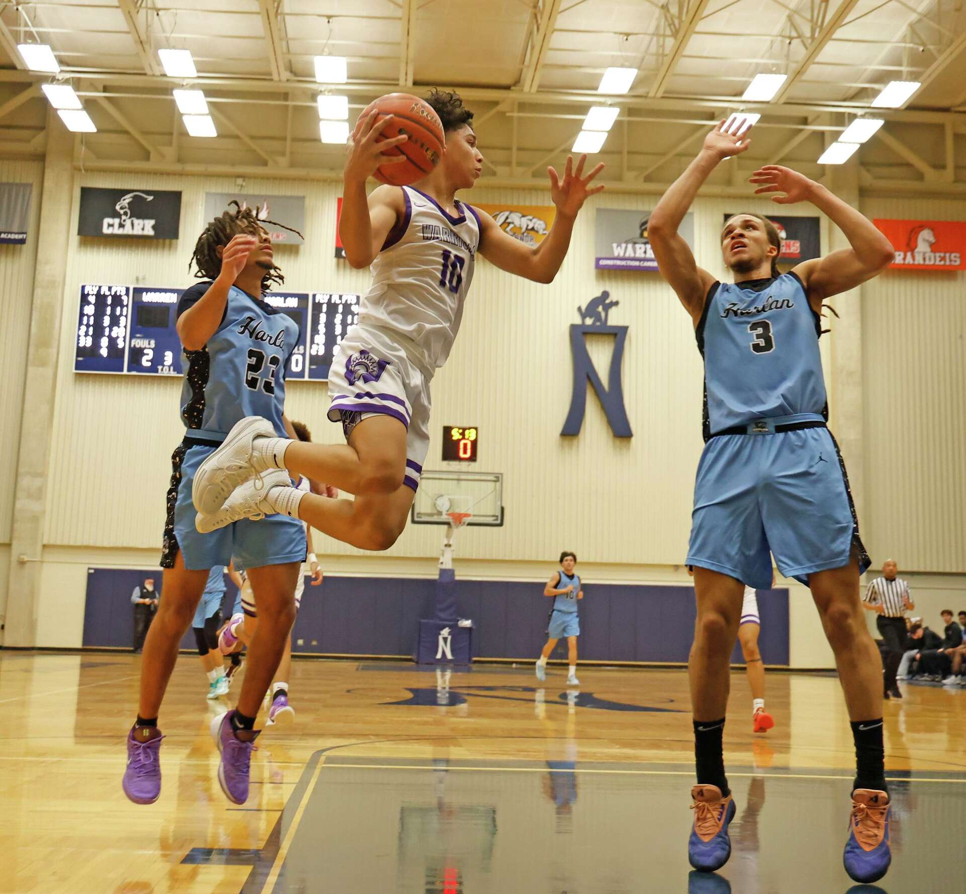 Warren boys basketball downs Harlan as Warriors’ rise continues