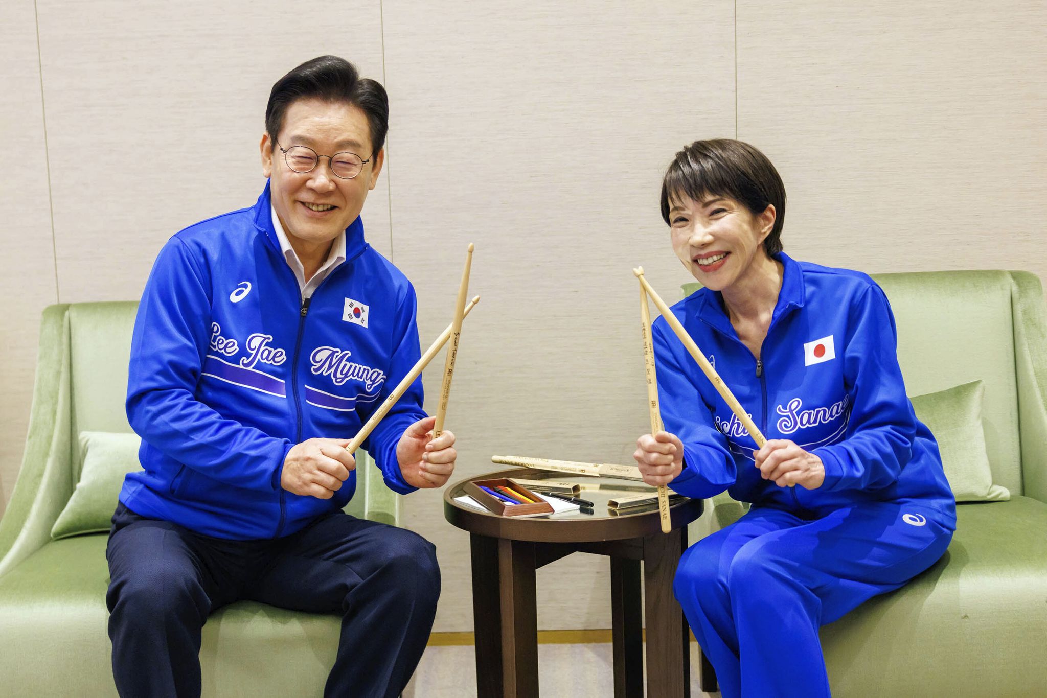 Japanese and South Korean leaders jam to K-pop hits at a summit