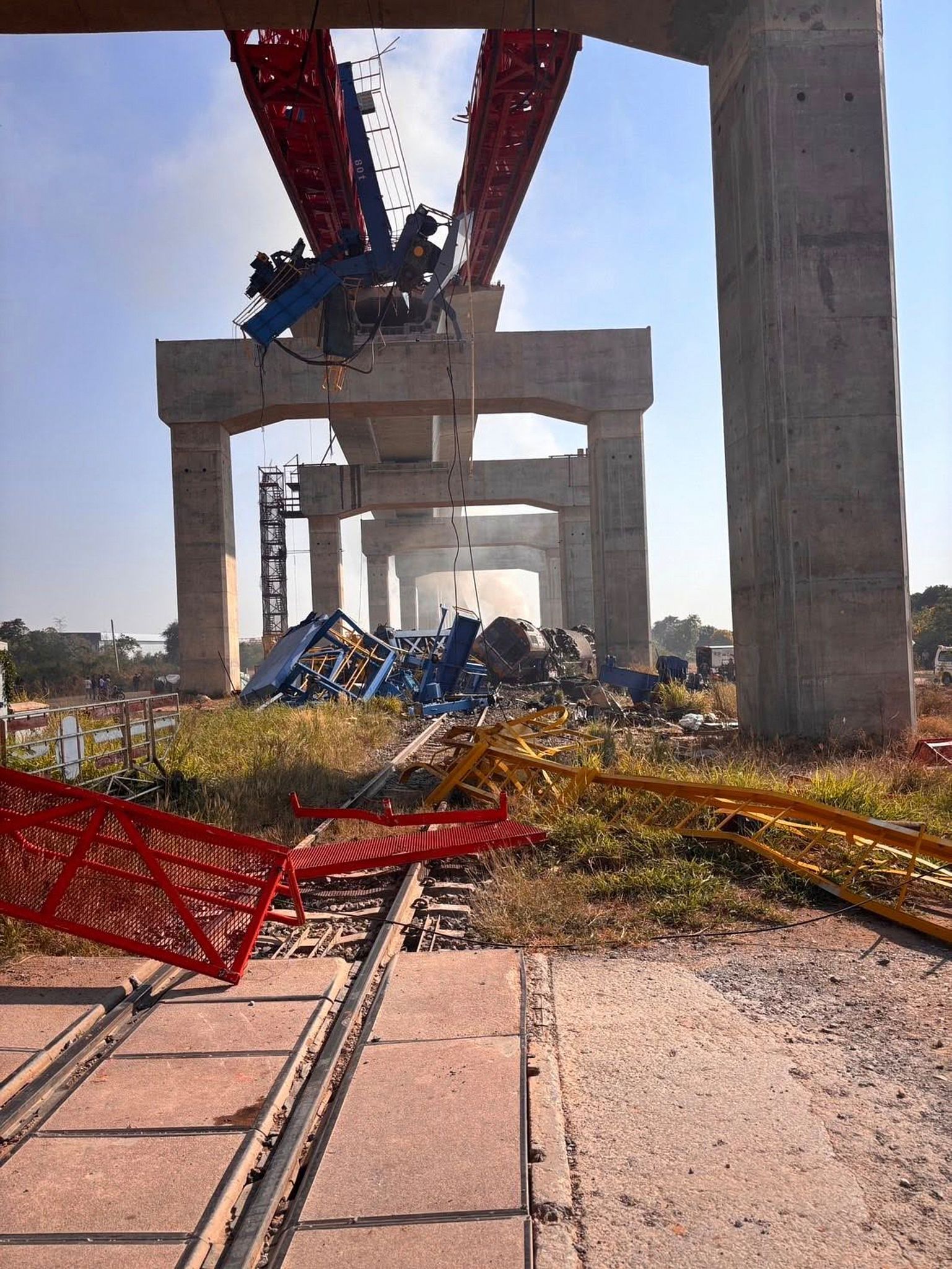 A construction crane falls on a passenger train in northeastern ...