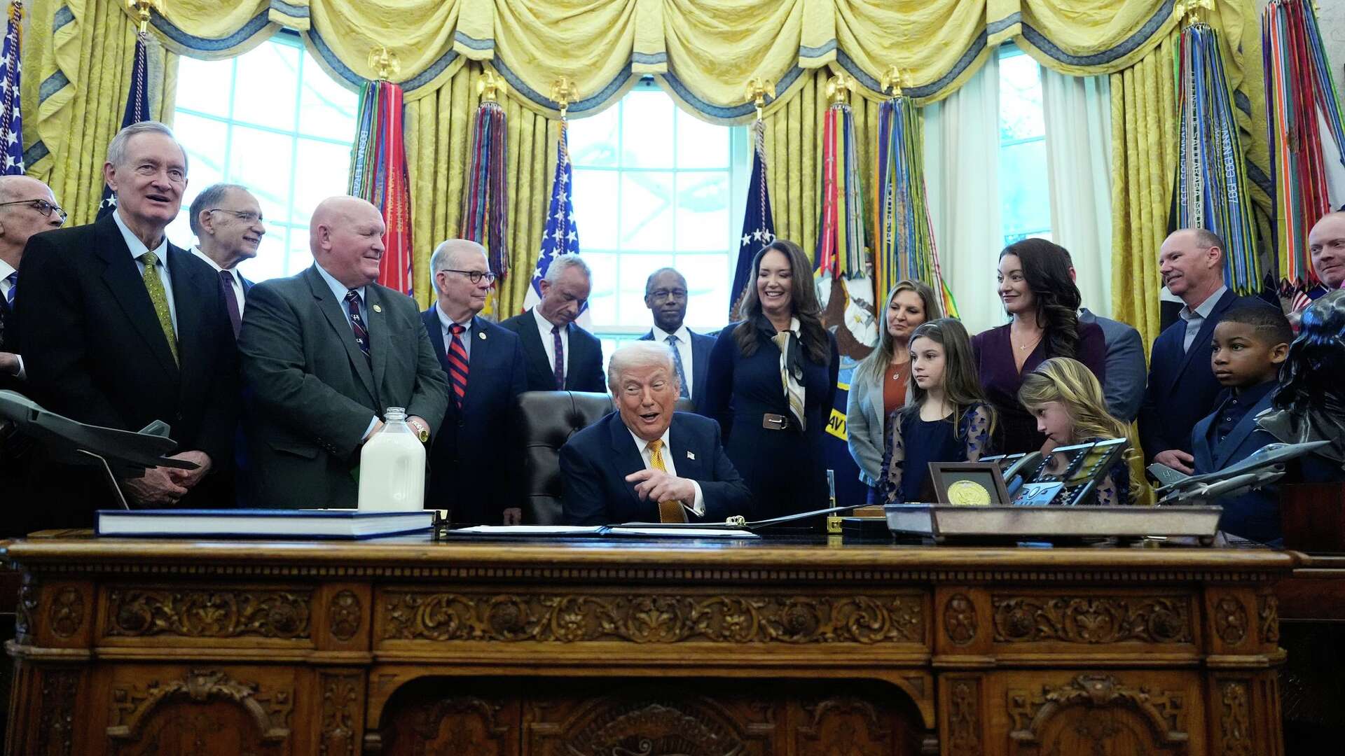 Milk gets a perch on Trump's desk but takes a back seat at bill signing