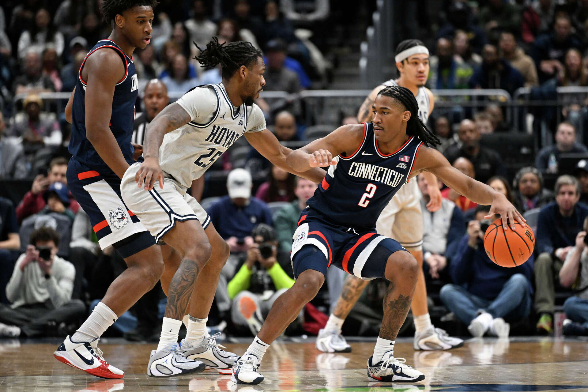 UConn men's basketball survives poor foul shooting, edge Georgetown.