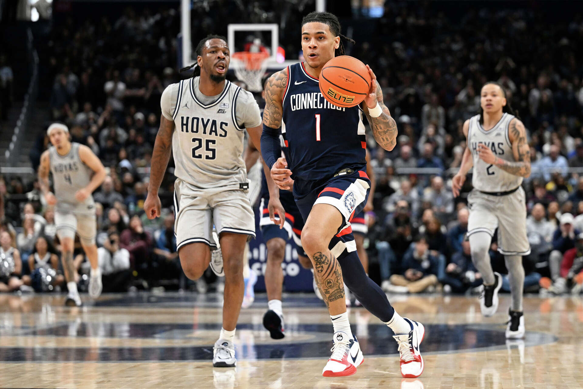UConn men's basketball survives poor foul shooting, edges Georgetown.
