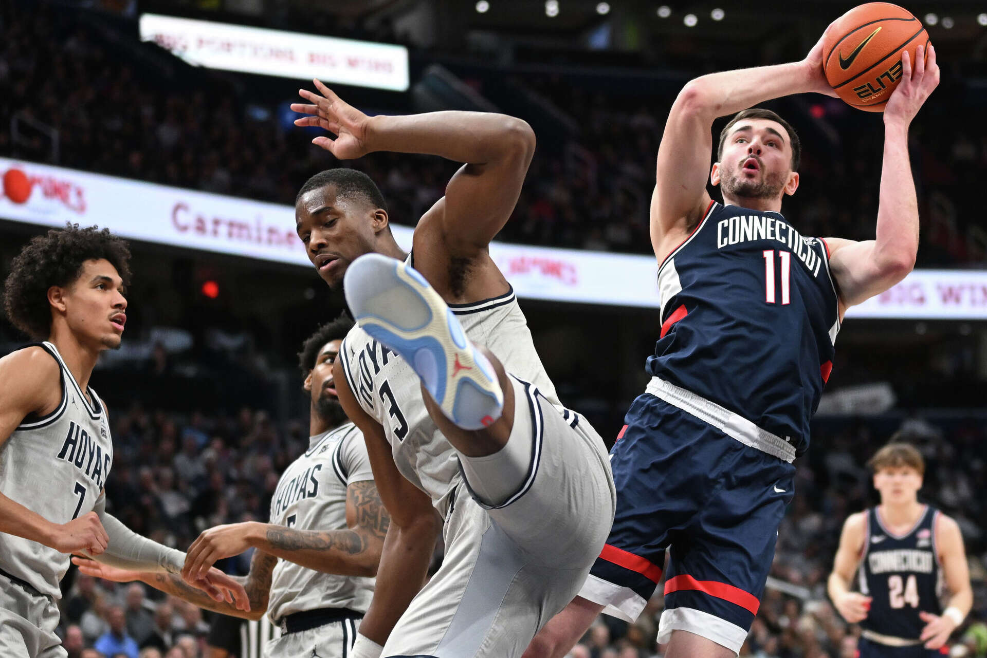 UConn men's basketball survives poor foul shooting, edges Georgetown.