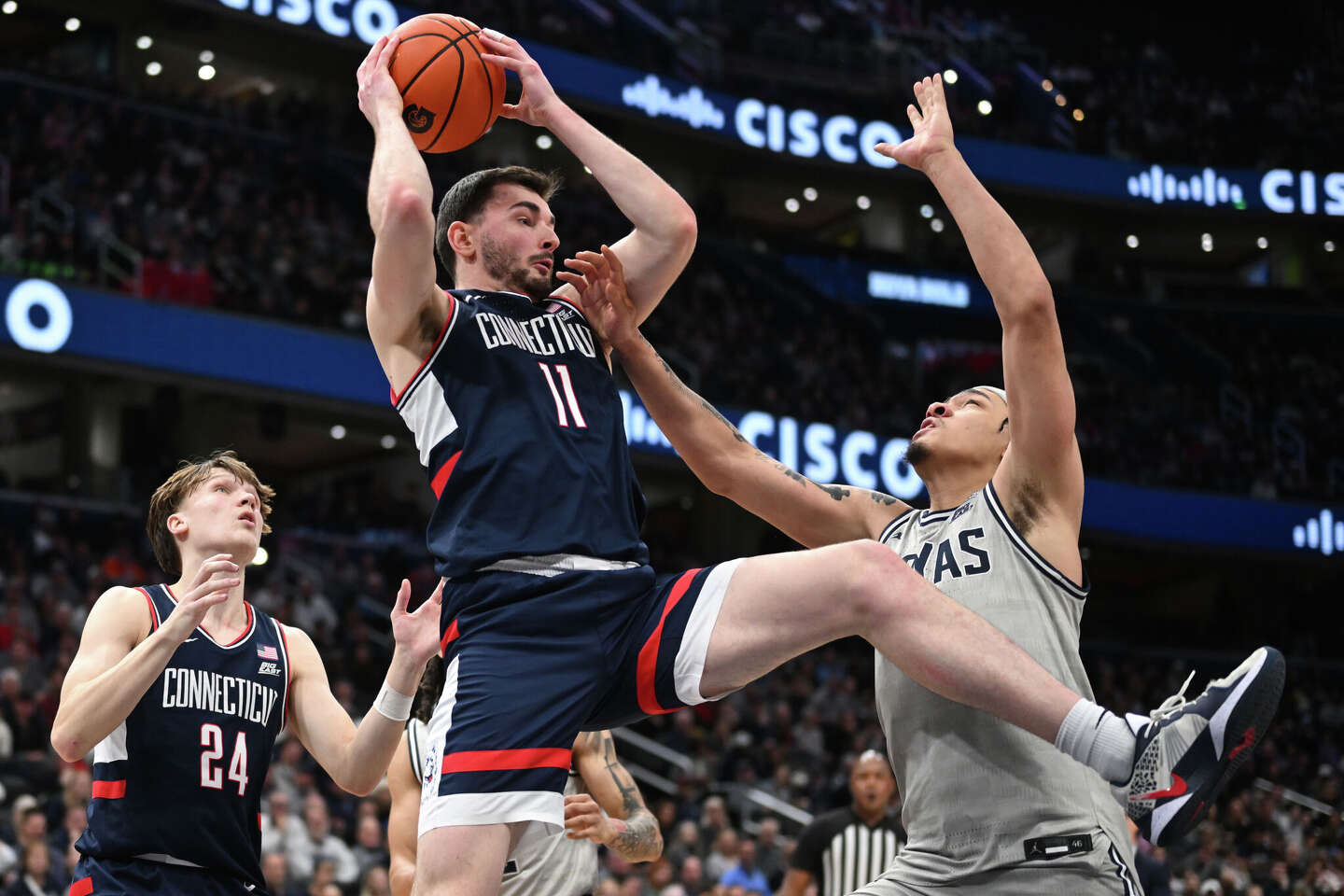 UConn men's basketball survives poor foul shooting, edges Georgetown.