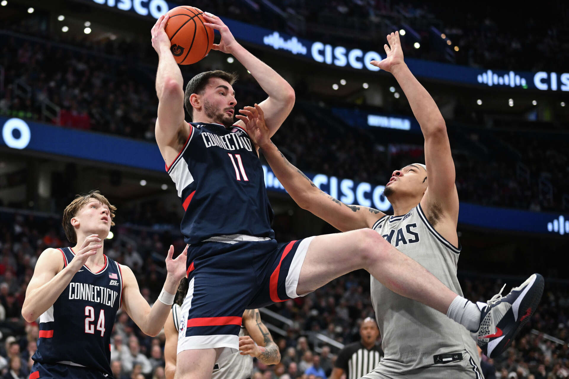 UConn men's basketball survives poor foul shooting, edges Georgetown.