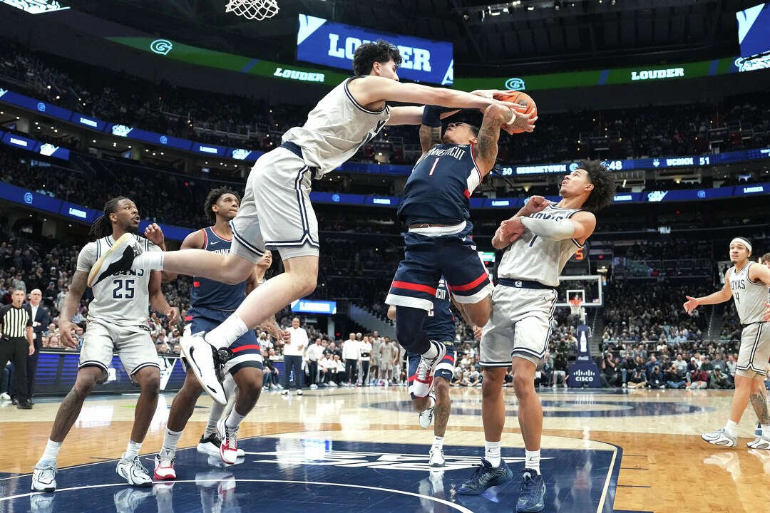 UConn men's basketball survives poor foul shooting, edges Georgetown.