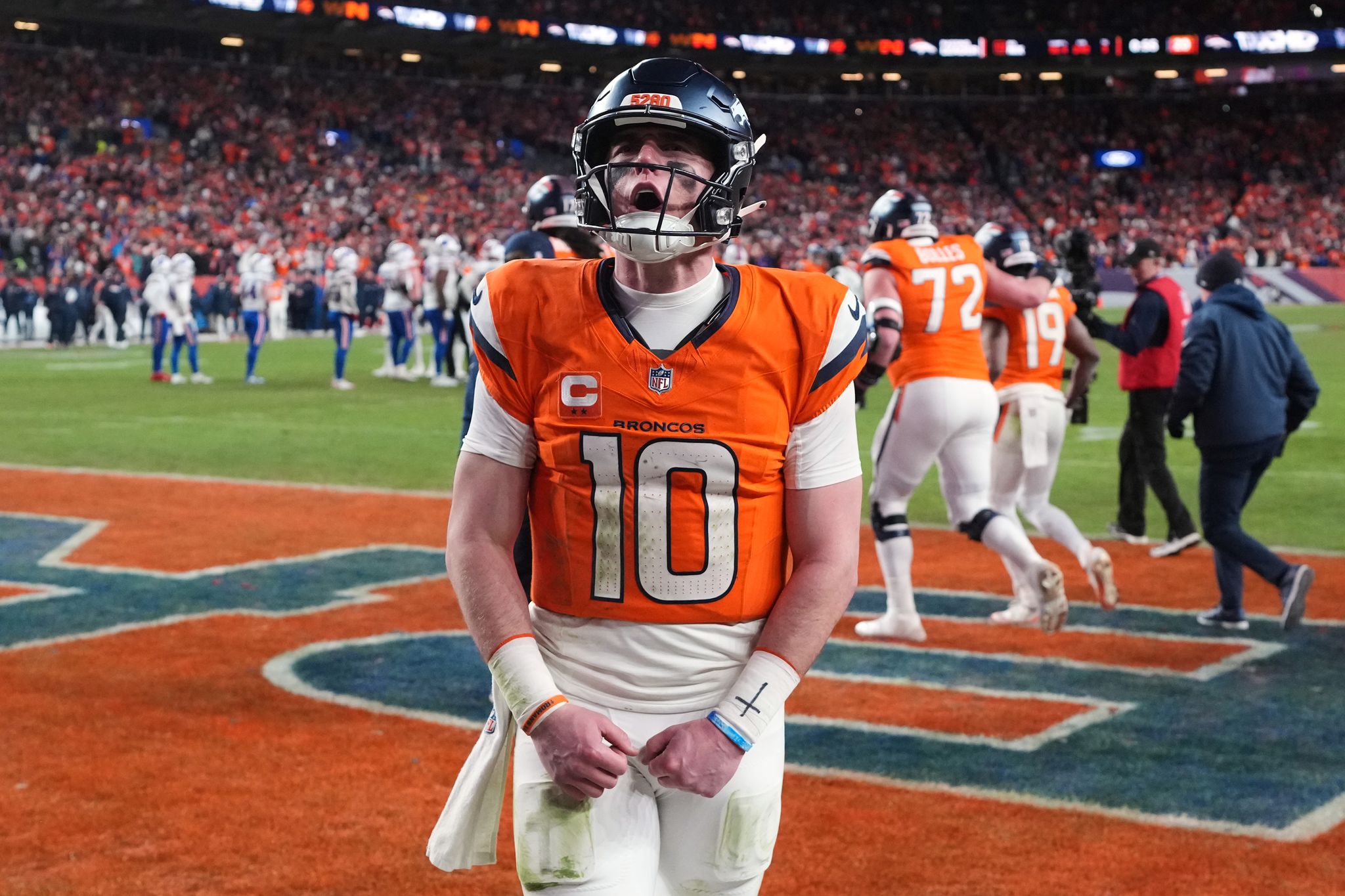 Bo Nix breaks his right ankle late in Broncos' playoff win, will have ...