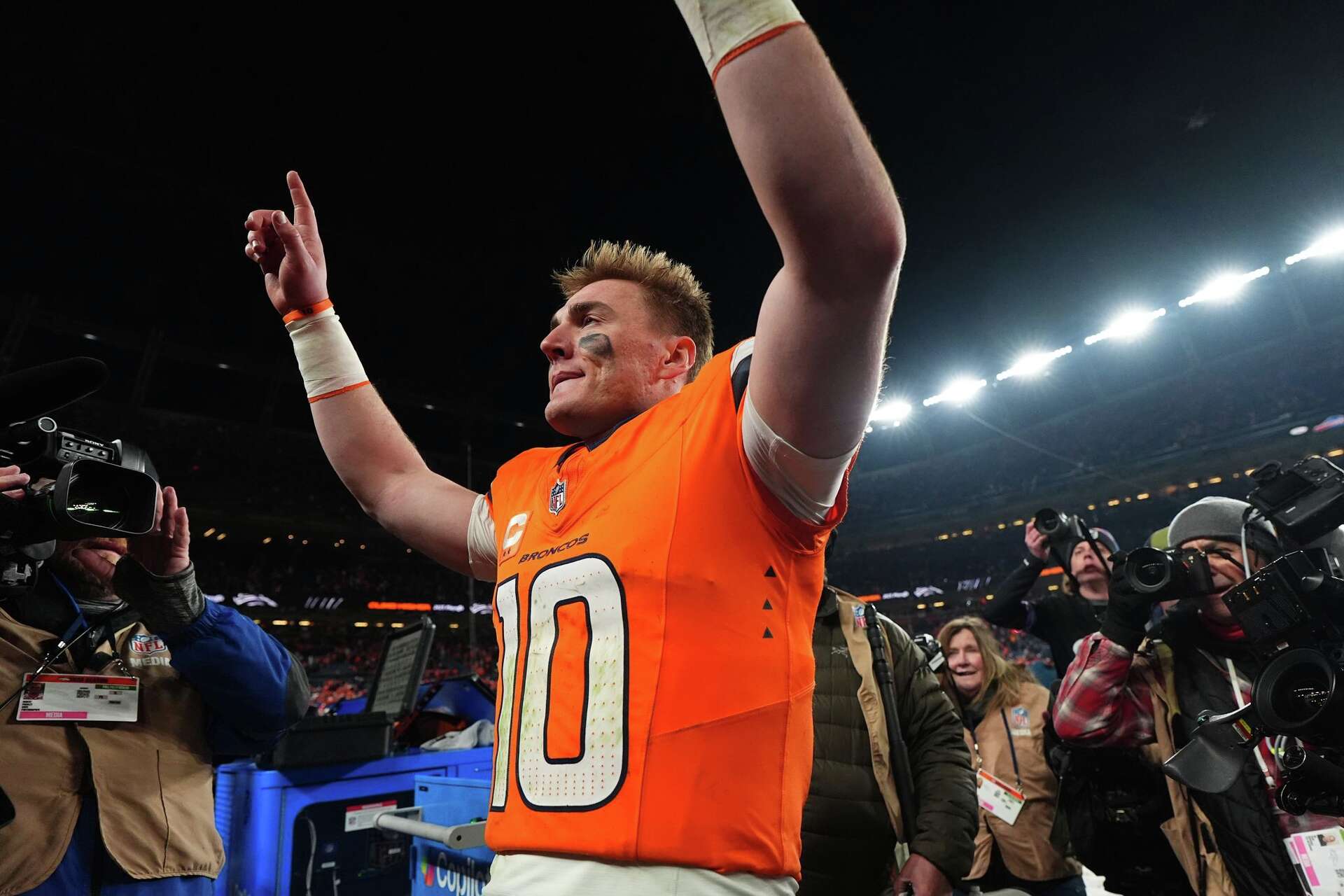 Bo Nix breaks his right ankle late in Broncos' playoff win, will have ...