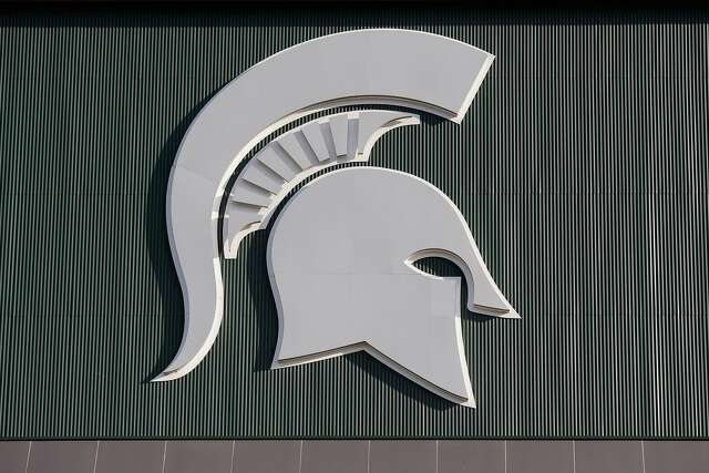 Former Michigan State player and director of hockey operations Dan ...