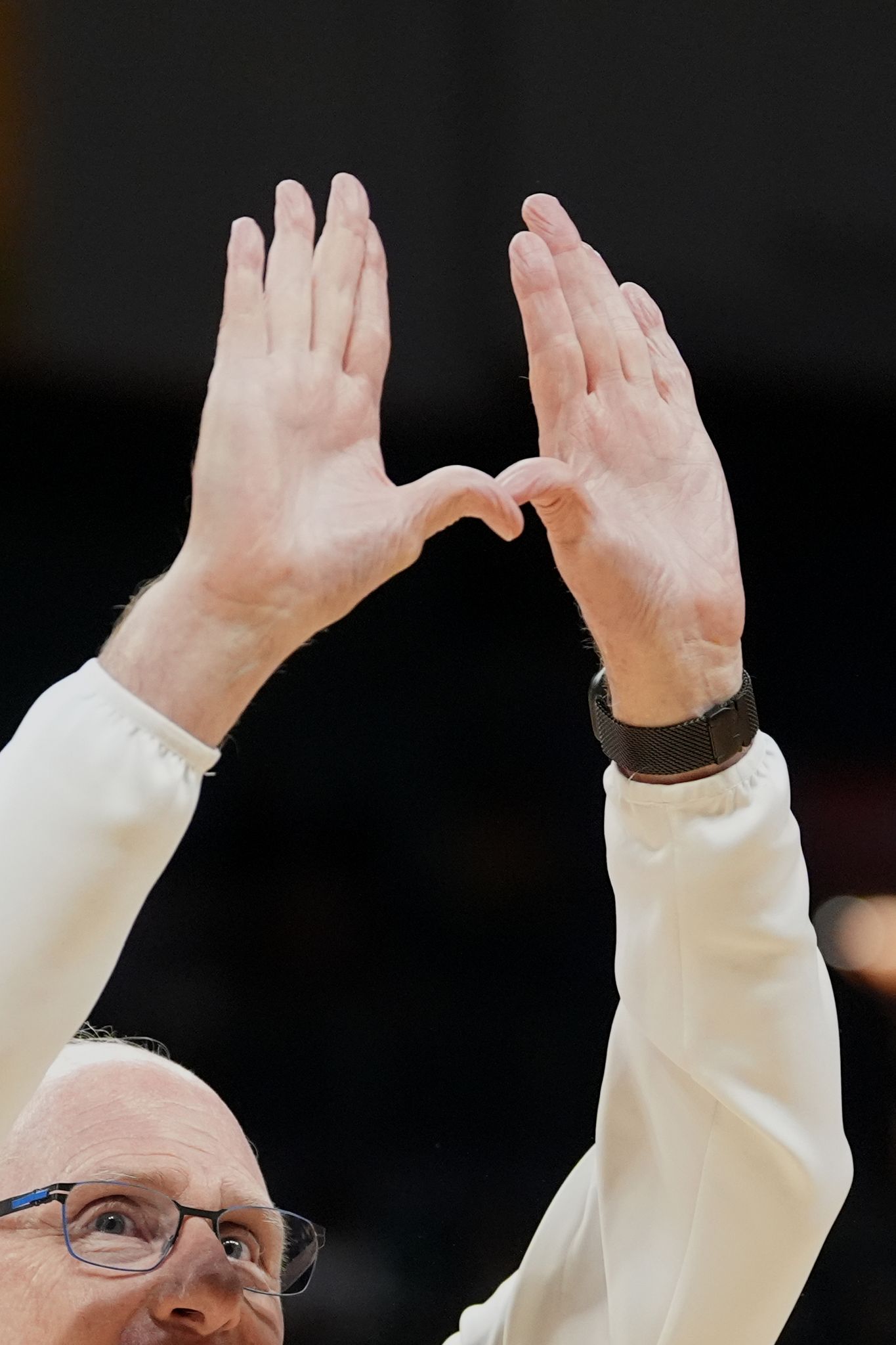 Miami unfurls a banner to honor retired coach Jim Larrañaga, who led ...