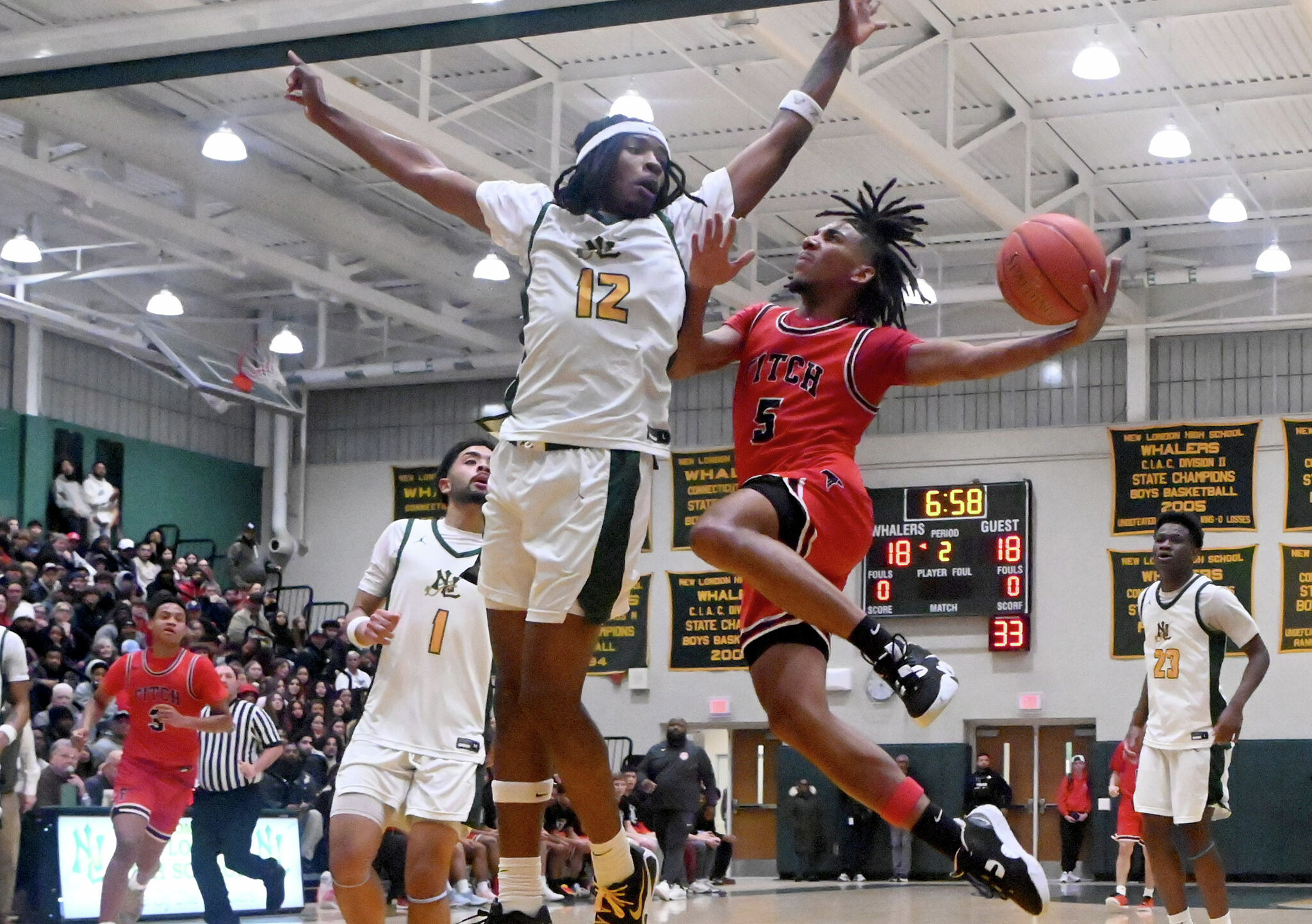 Photos of the Fitch at New London boys basketball game