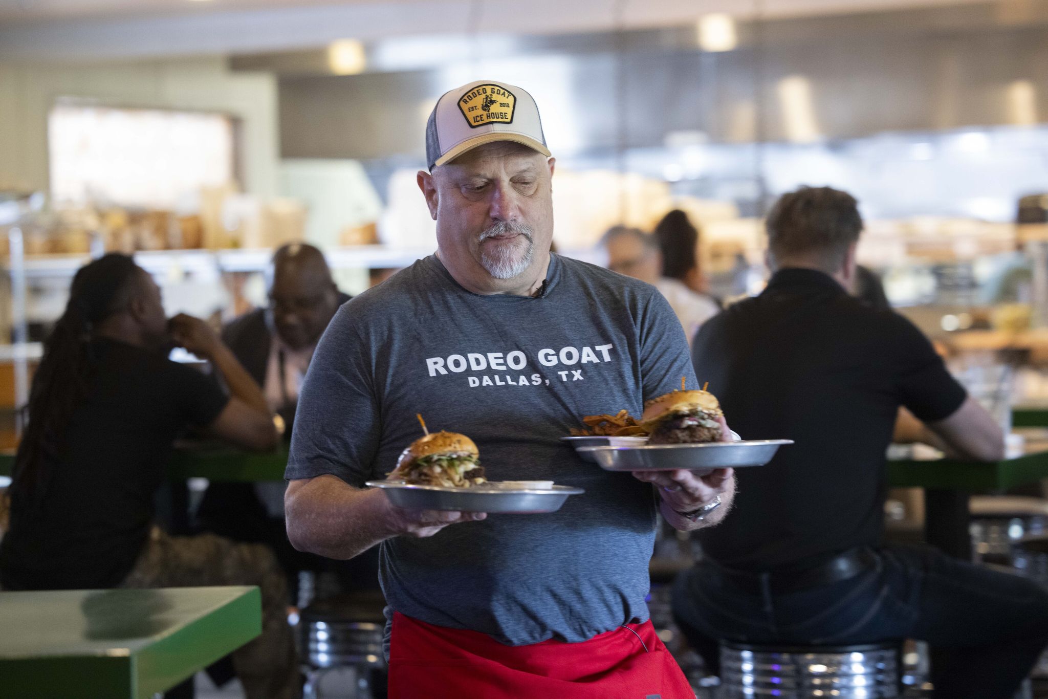 DMN Rangers insider serving burgers to raise money for local youth