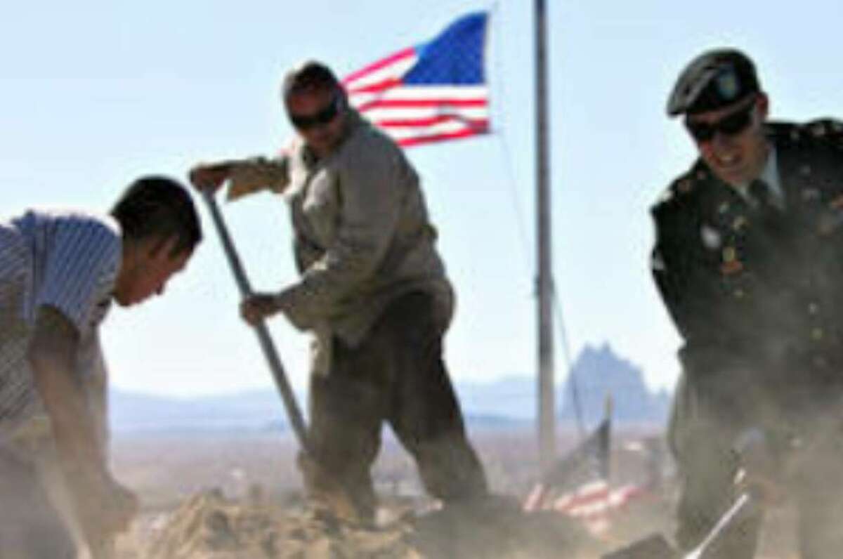 Sad but proud, a family mourns two fallen soldiers