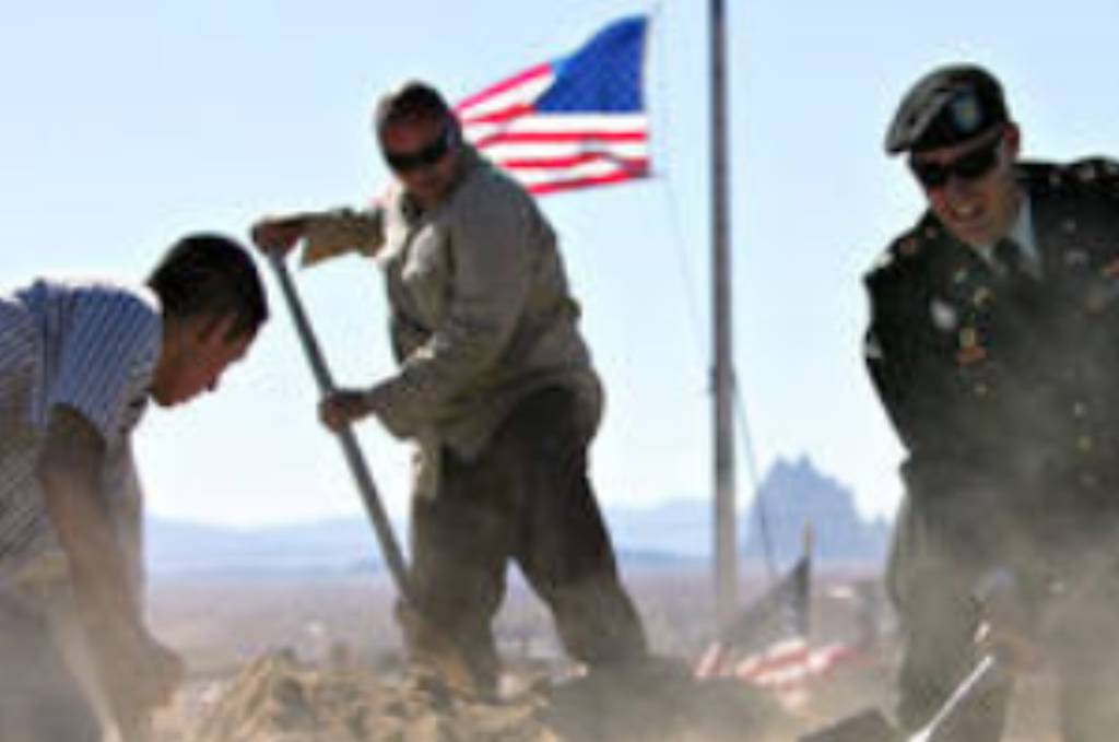 Sad but proud, a family mourns two fallen soldiers