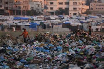 People in Gaza dig through garbage for things to burn to keep warm — a ...