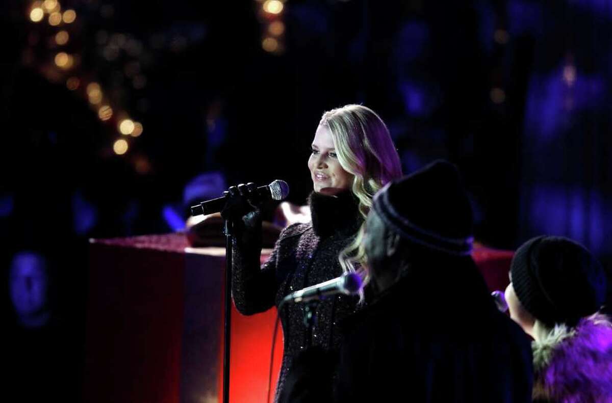 NYC's Rockefeller Center lit as thousands watch