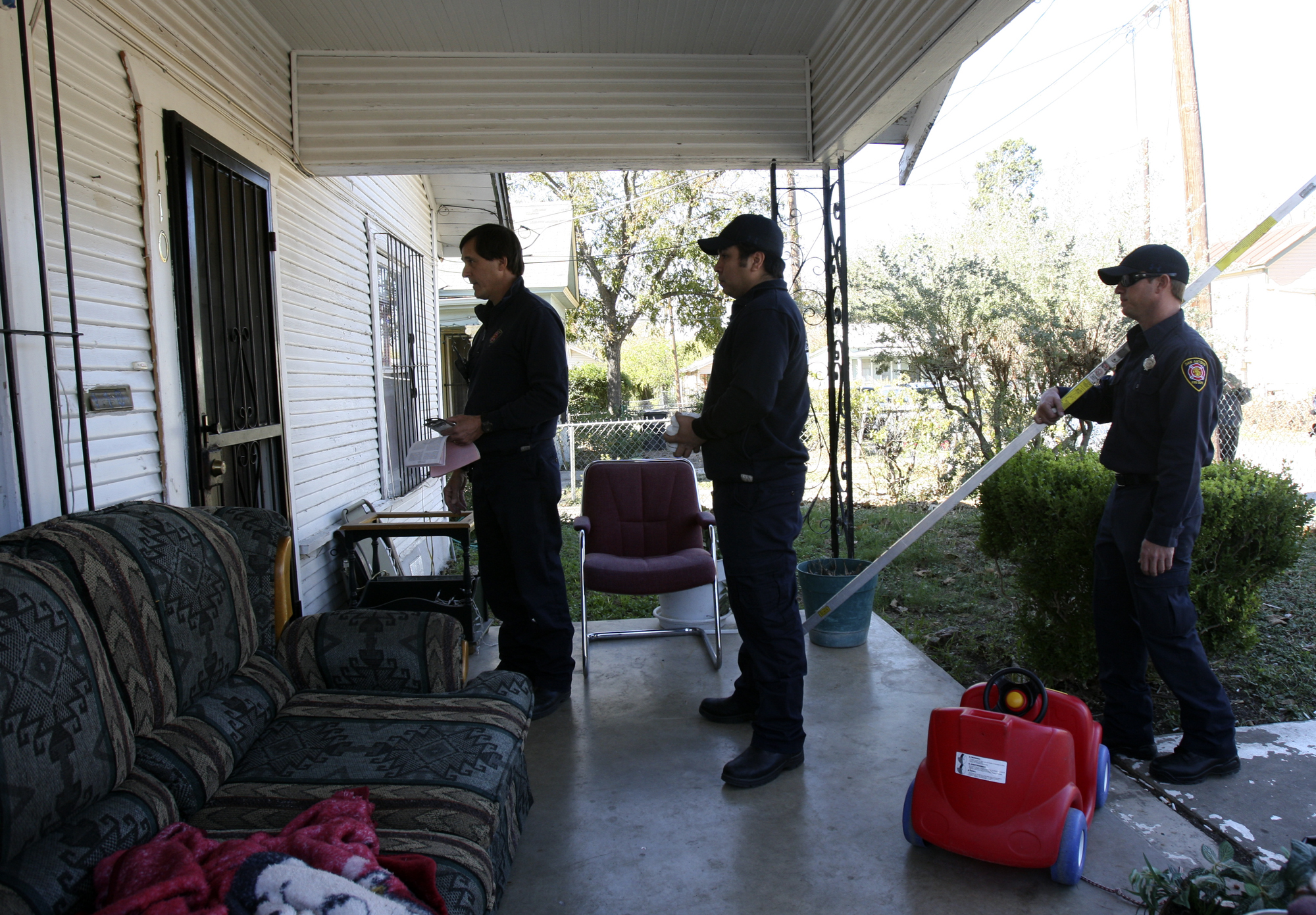 Firefighters install alarms after fatal fire