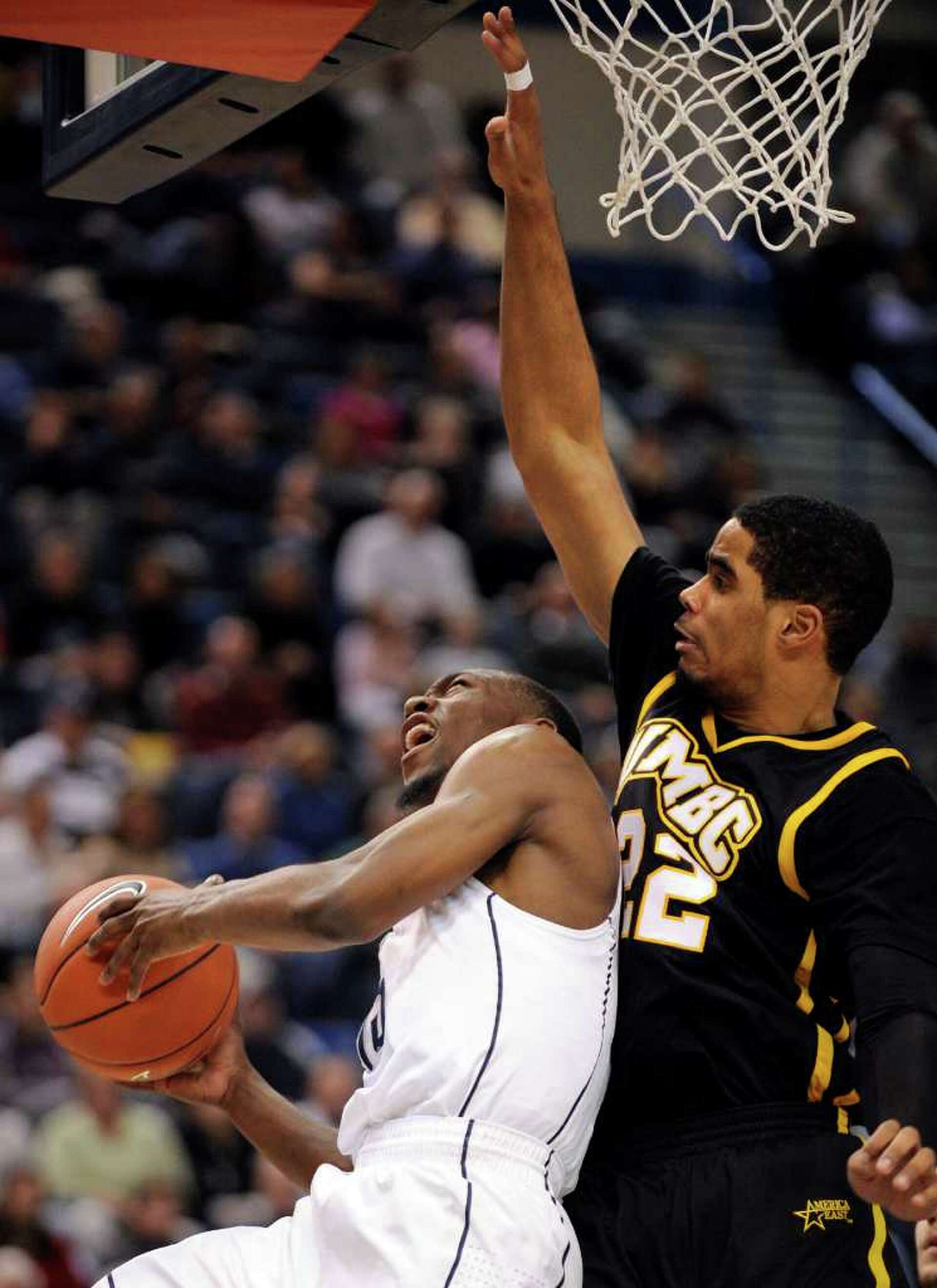 Walker's triple-double paces UConn rout