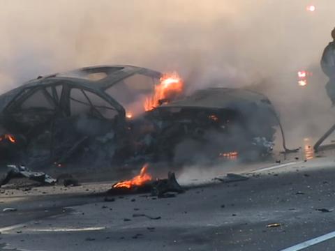 Car fire critically injures two, shuts down I-95