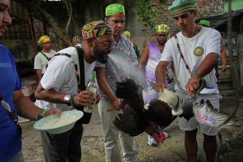 Cuba's Santeros offer gifts and ask deities for peace as tensions rise ...