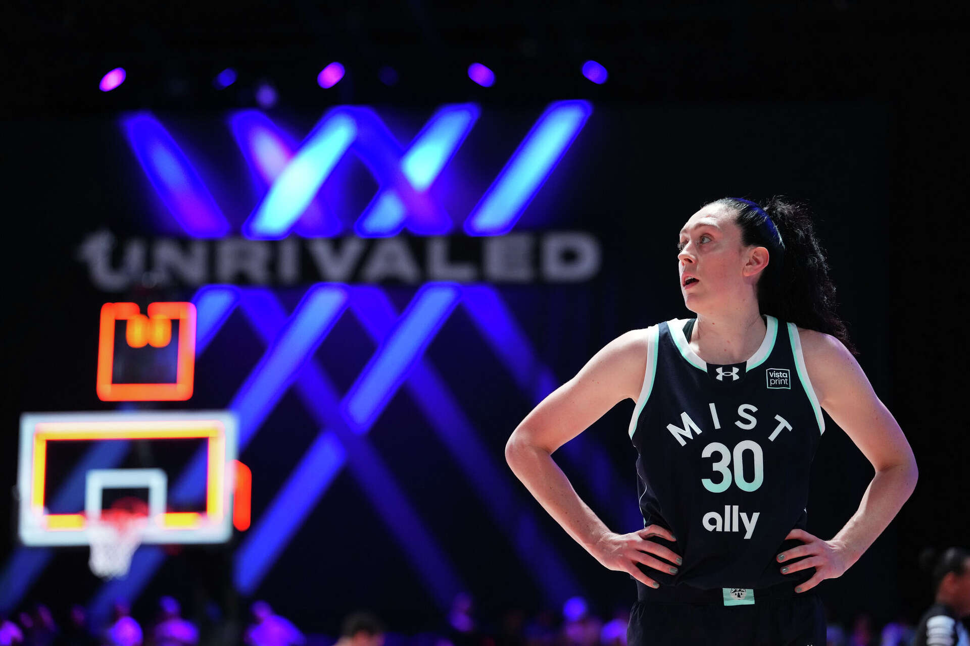 UConn alum Breanna Stewart holds up 'Abolish ICE' sign