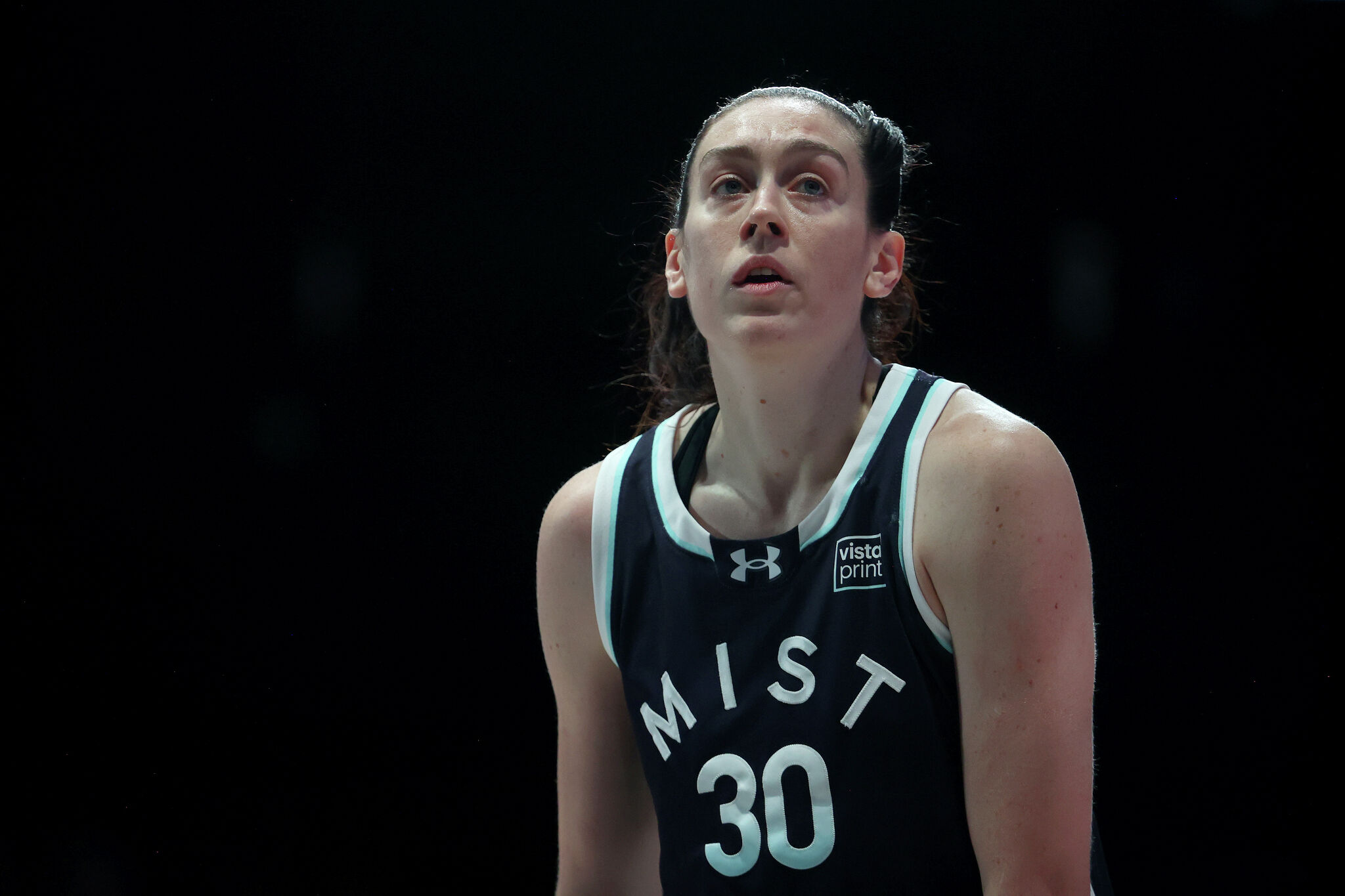 UConn alum Breanna Stewart holds up 'Abolish ICE' sign