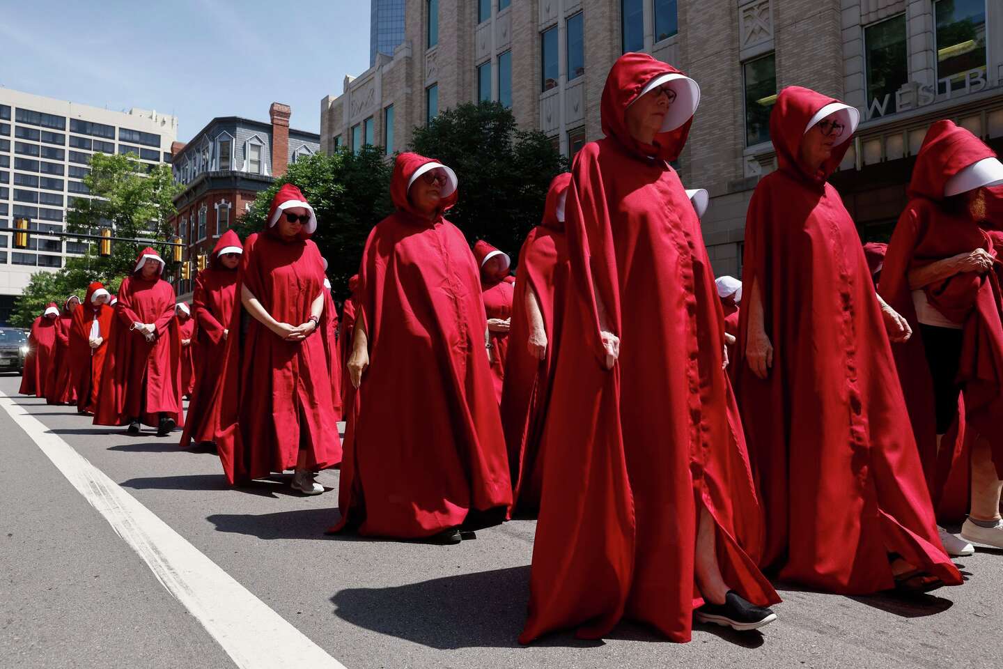 The story behind the Handmaid's Tale-themed rally on Saturday