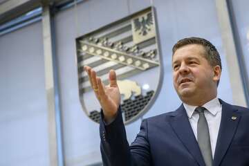 Lawmakers in German state elect new governor to counter far-right rise