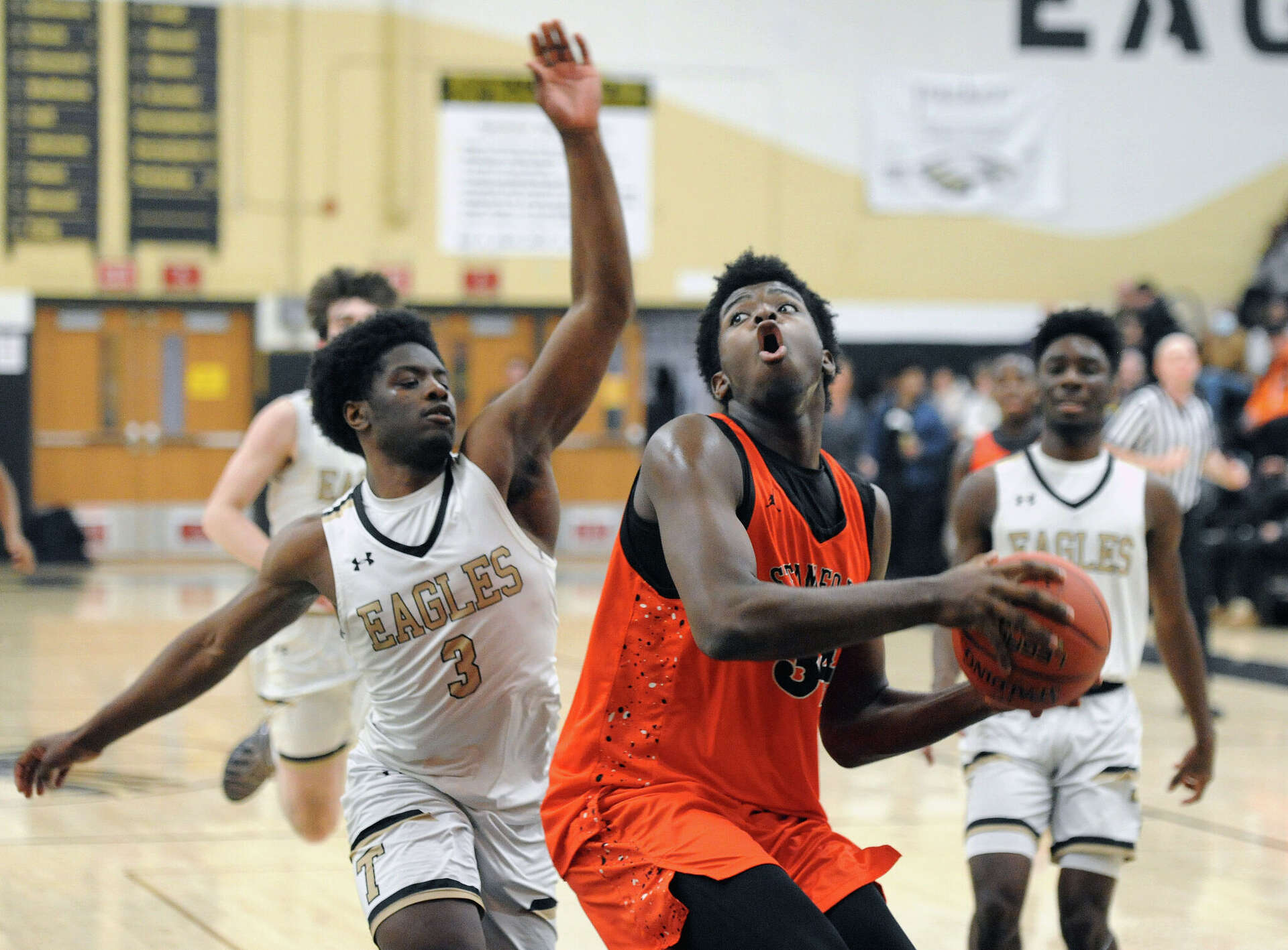 Wilson, 10th-ranked Trumbull boys basketball pull away from Stamford